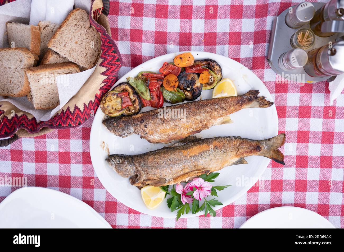 Lin, Albania. 01st May, 2023. A grilled Ohrid trout lies on a plate ...