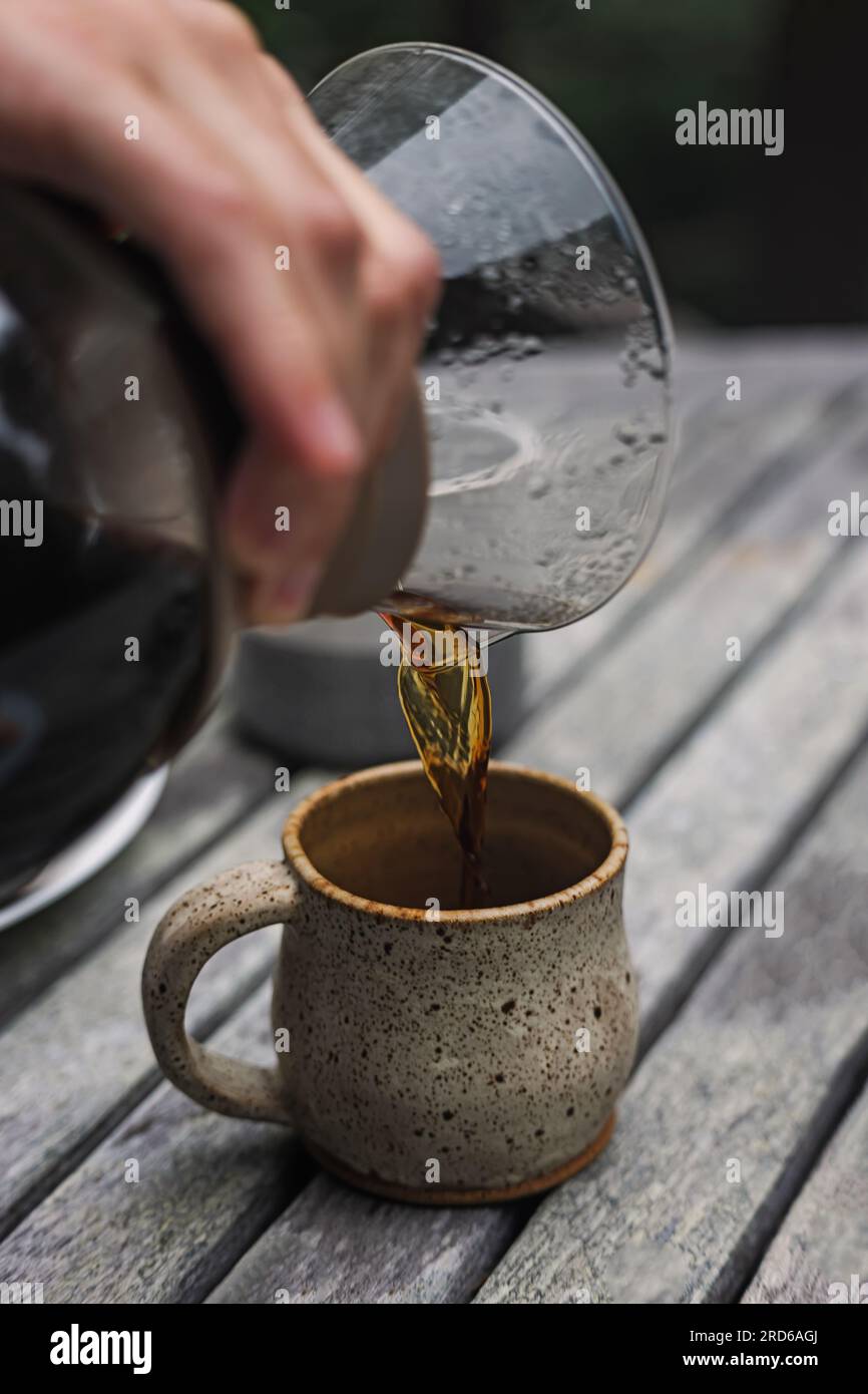 Hot coffee pouring from glass hi-res stock photography and images - Alamy