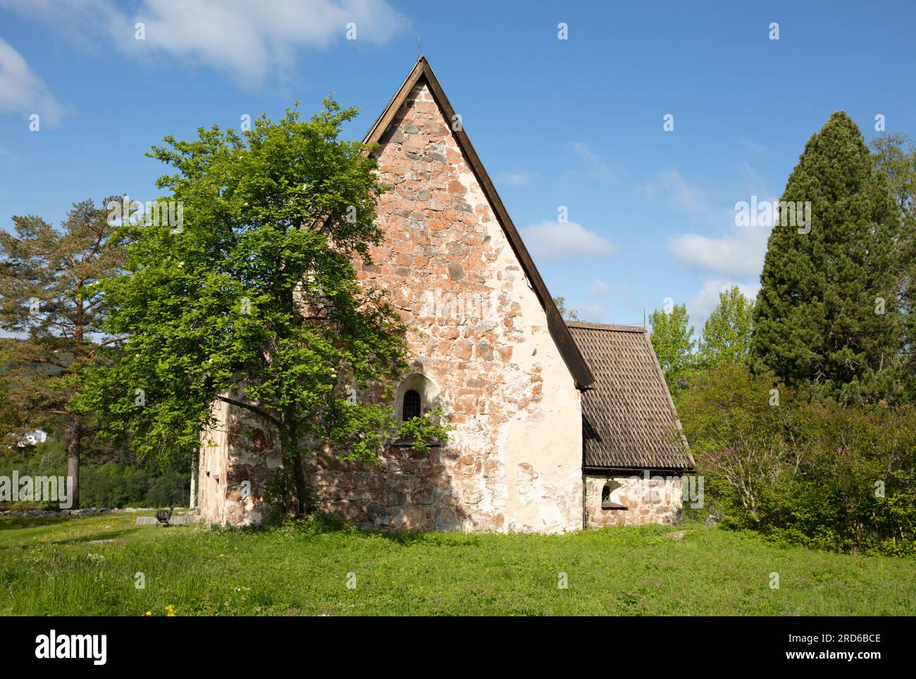 RAGUNDA, SWEDEN ON JUNE 07, 2023. View of an old stone church. Built-in ...