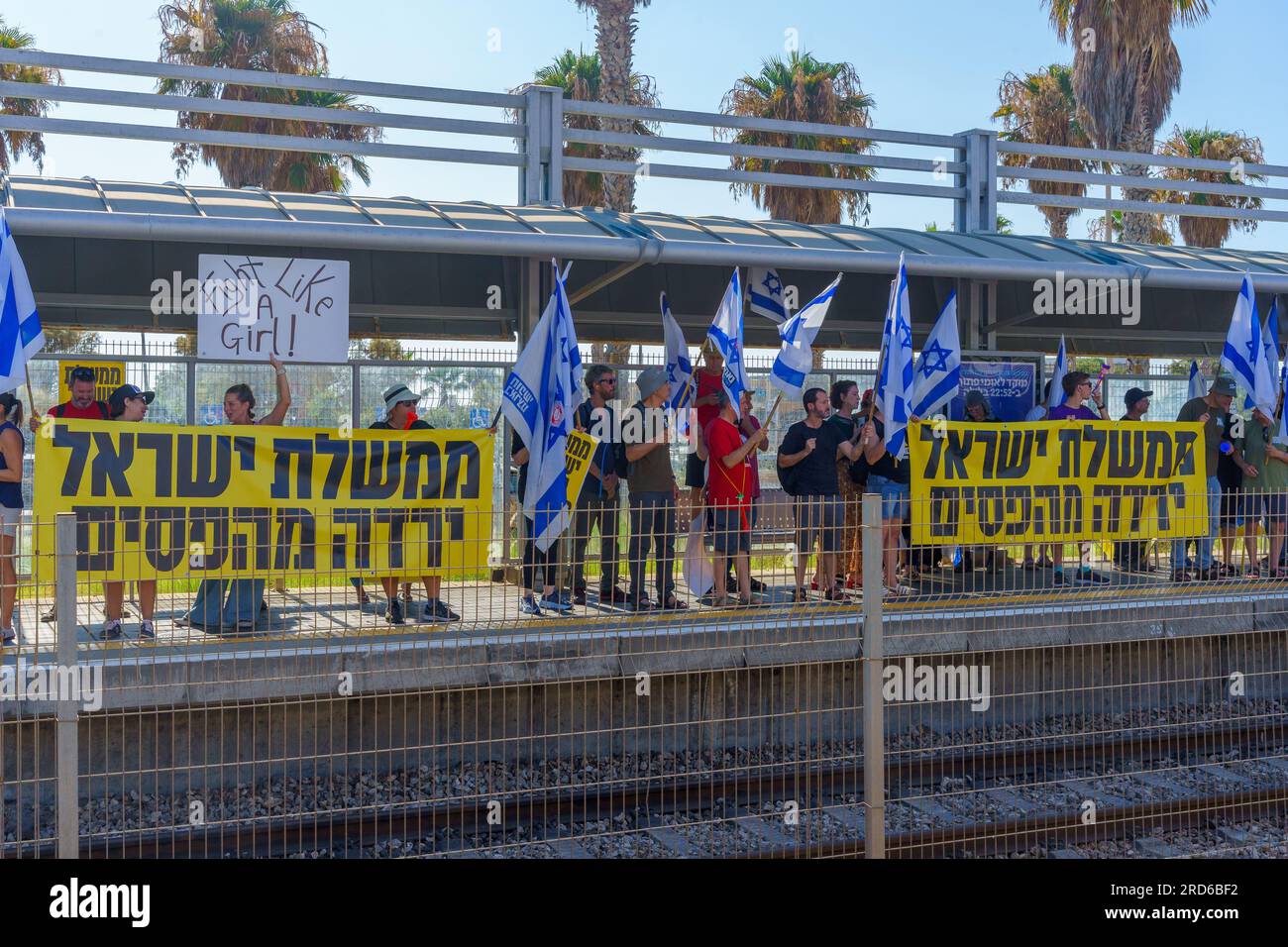 Haifa, Israel - July 18, 2023: People protest with flags and various ...