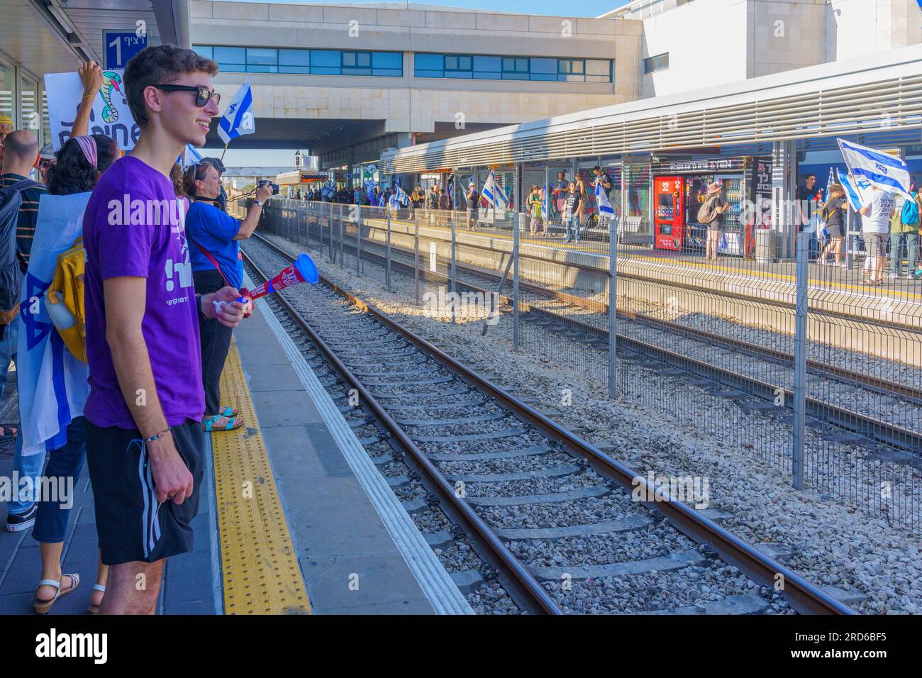 Haifa, Israel - July 18, 2023: People protest with flags and various ...