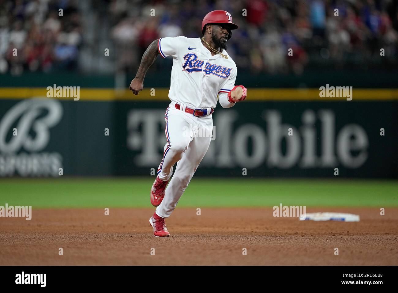 Texas Rangers' Adolis Garcia sprints to third during a baseball game ...