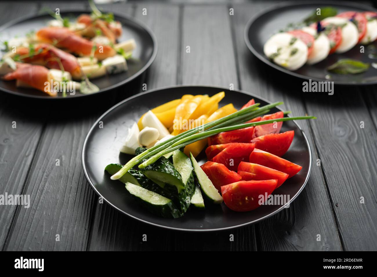 Party table setting with various veggie snacks and vegetarian starters ...