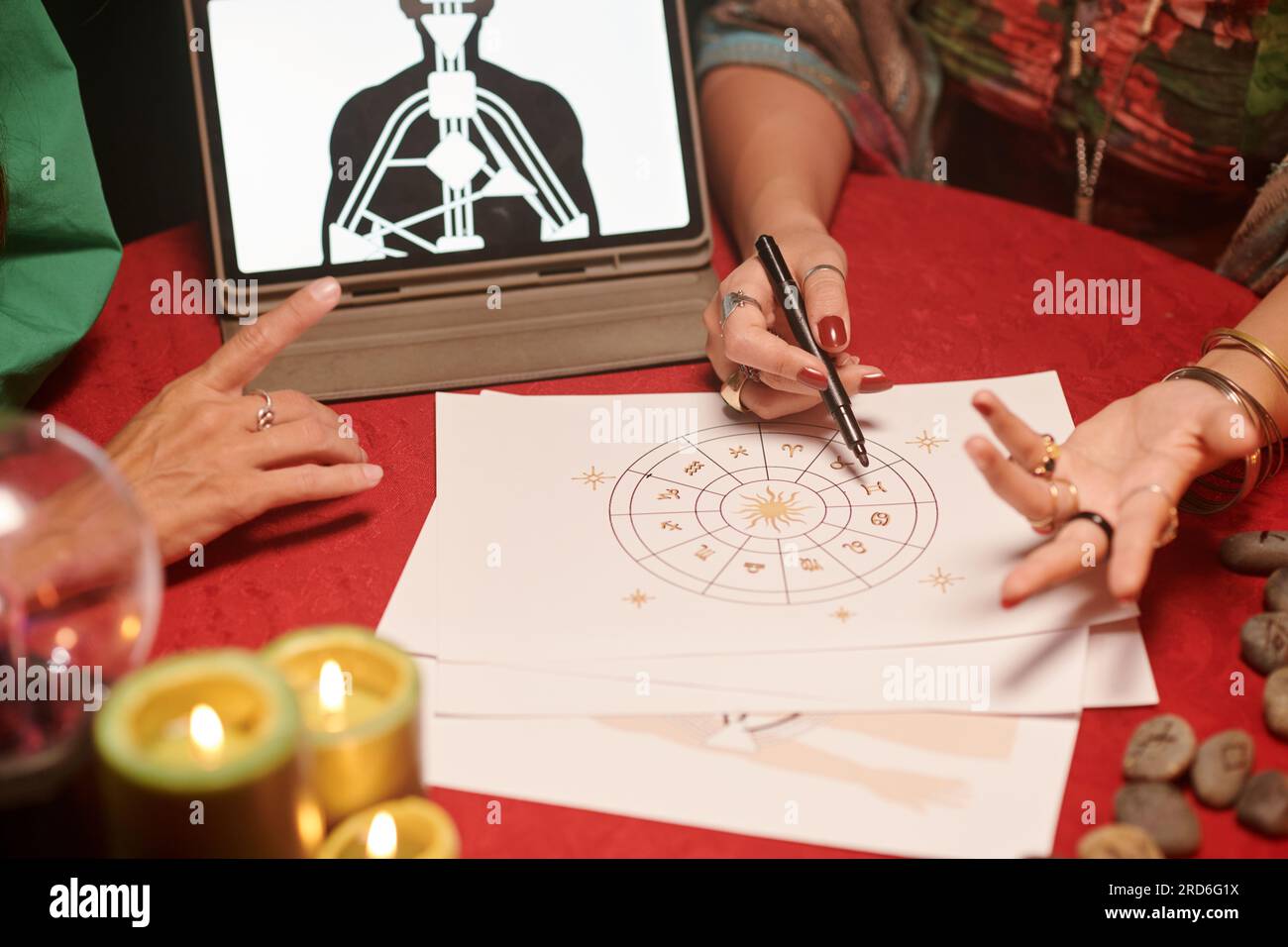 Astrologer analyzing natal chart of female client and giving her advice ...