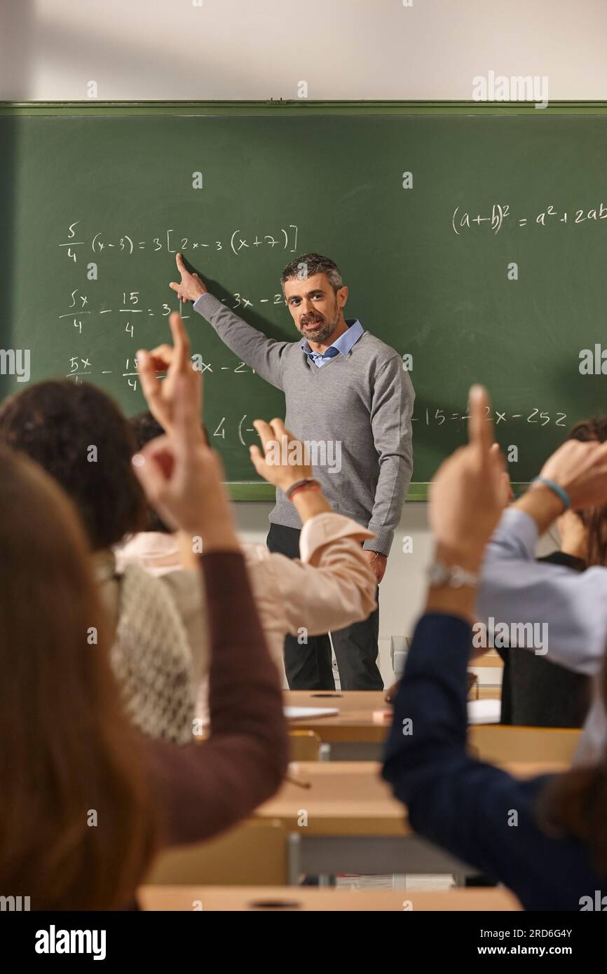 Math teacher giving lessons. Classroom with students. School education ...