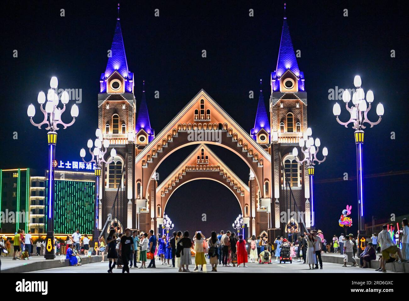 Burqin. 18th July, 2023. Tourists visit a bridge at Qicai river resort ...
