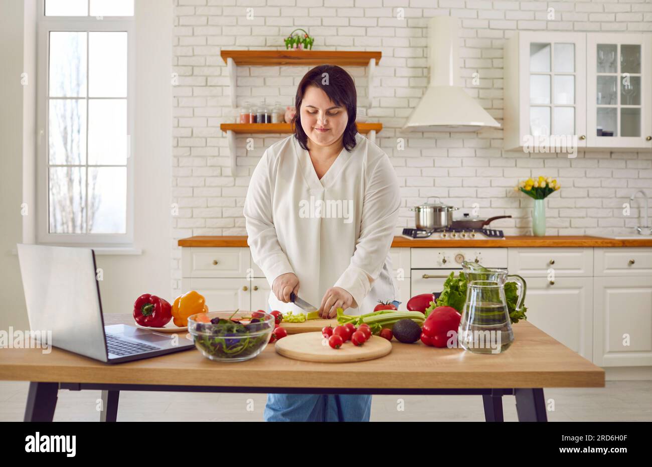 Overweight healthy cooking woman hi-res stock photography and images ...