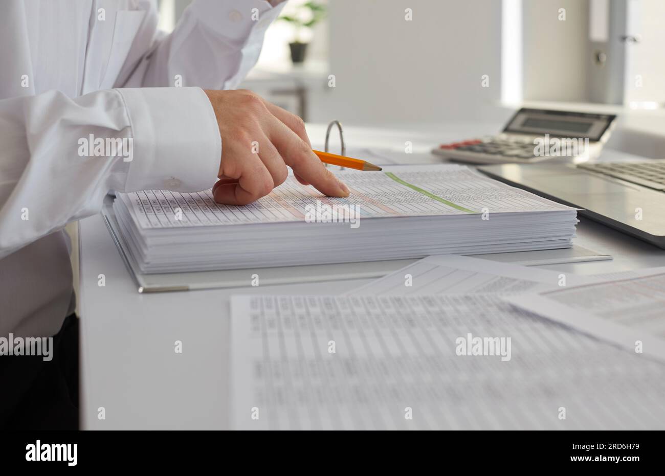 Male hand working with paper business documents in office Stock Photo ...