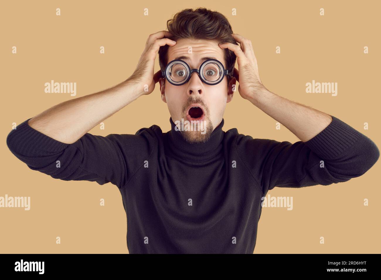 Funny student panicking and looking at the camera with a shocked scared ...