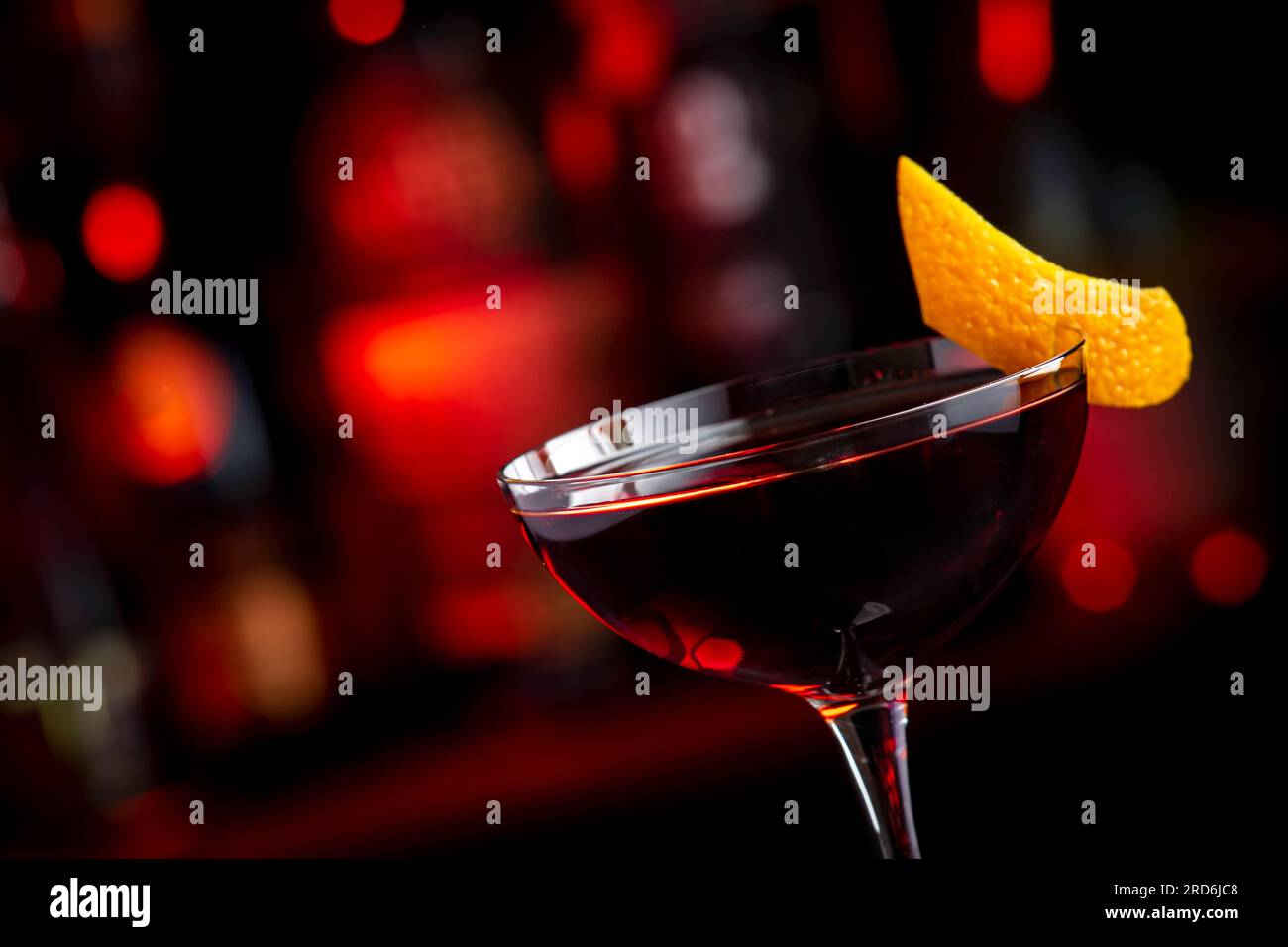 Adonis alcoholic cocktail drink with sherry and red vermouth, black bar ...