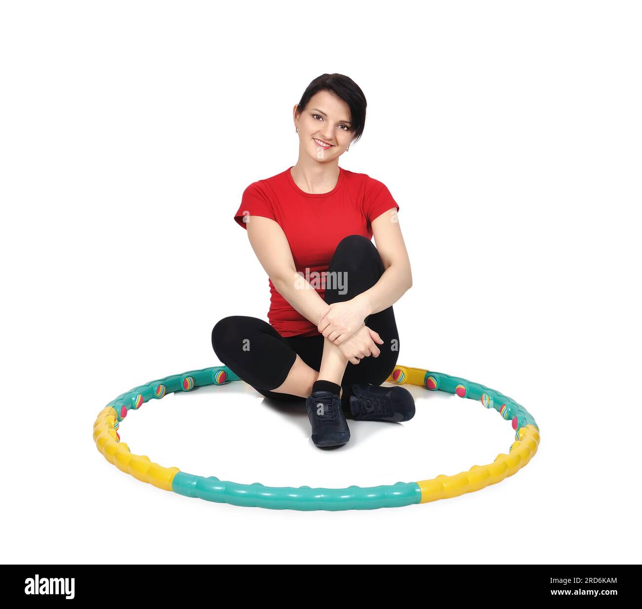 beauty girl sitting with hula hoop on floor Stock Photo - Alamy