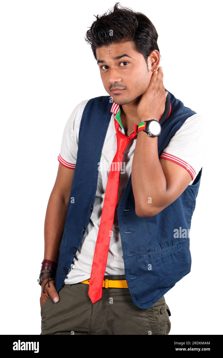 A young Indian guy appearing to be questioning, on white studio ...