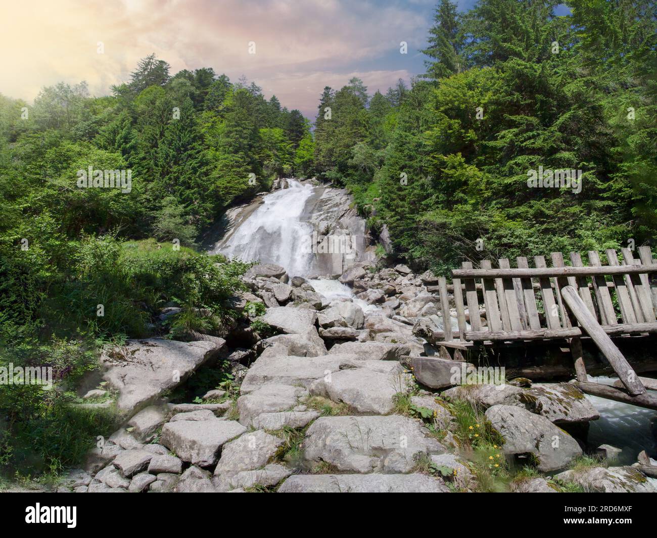 wooden bridge that crosses the waterfall in amola trentino Stock Photo ...