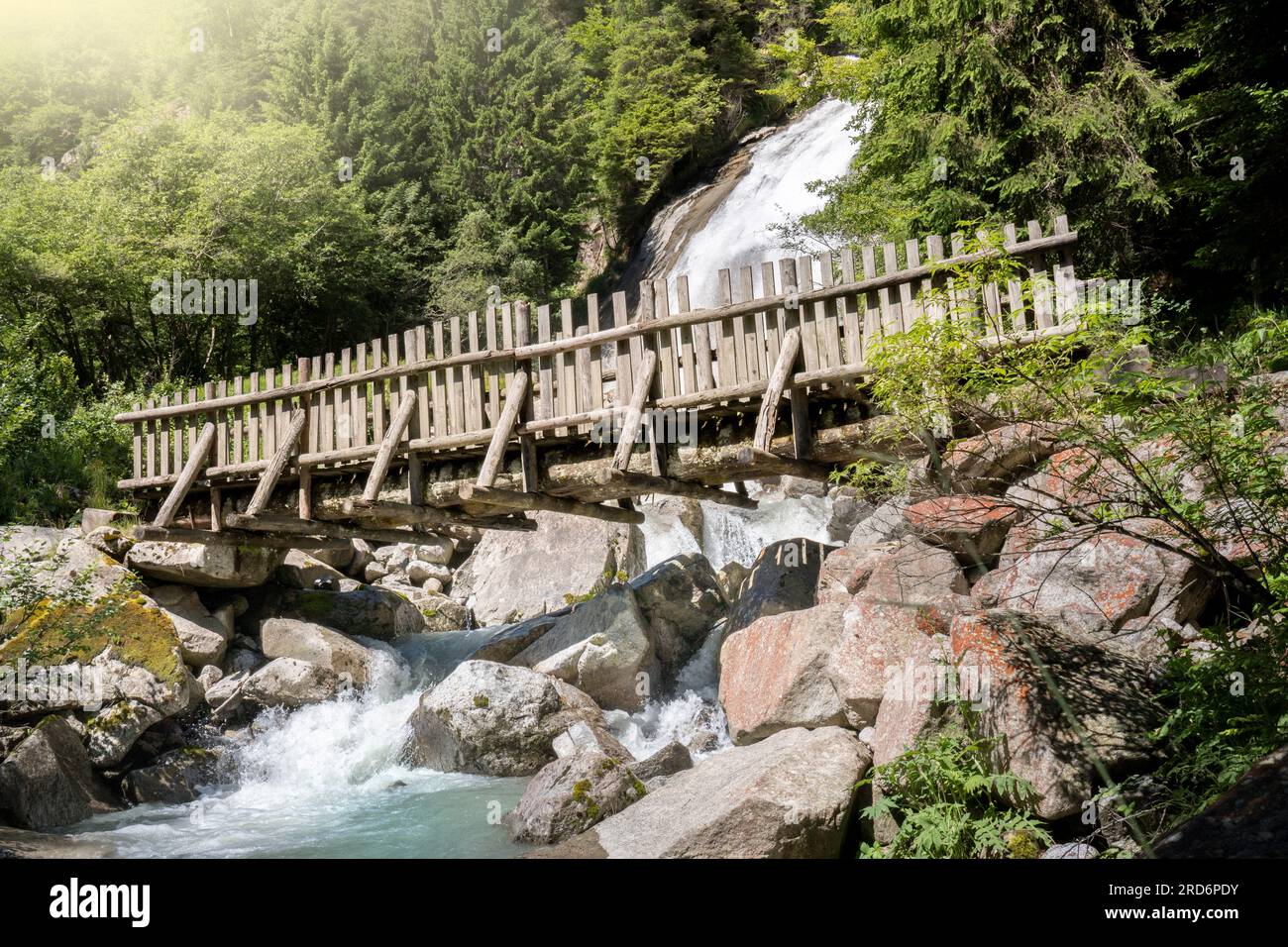 wooden bridge that crosses the amola waterfall in the nambrone valley ...