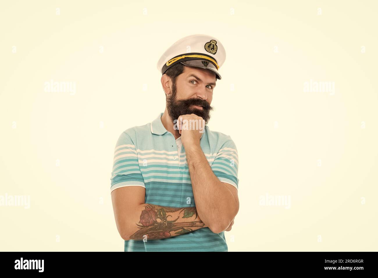 Happy captain propping chin. Bearded man wearing captain hat. Man ...