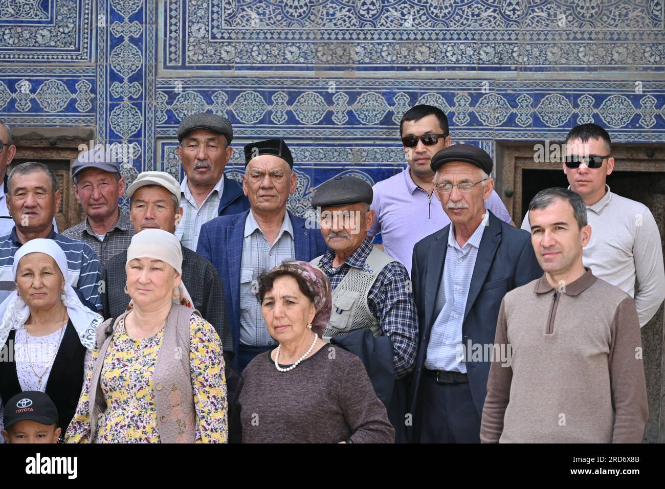 Group of old uzbek people posing for a group photo inside a madrasa in ...