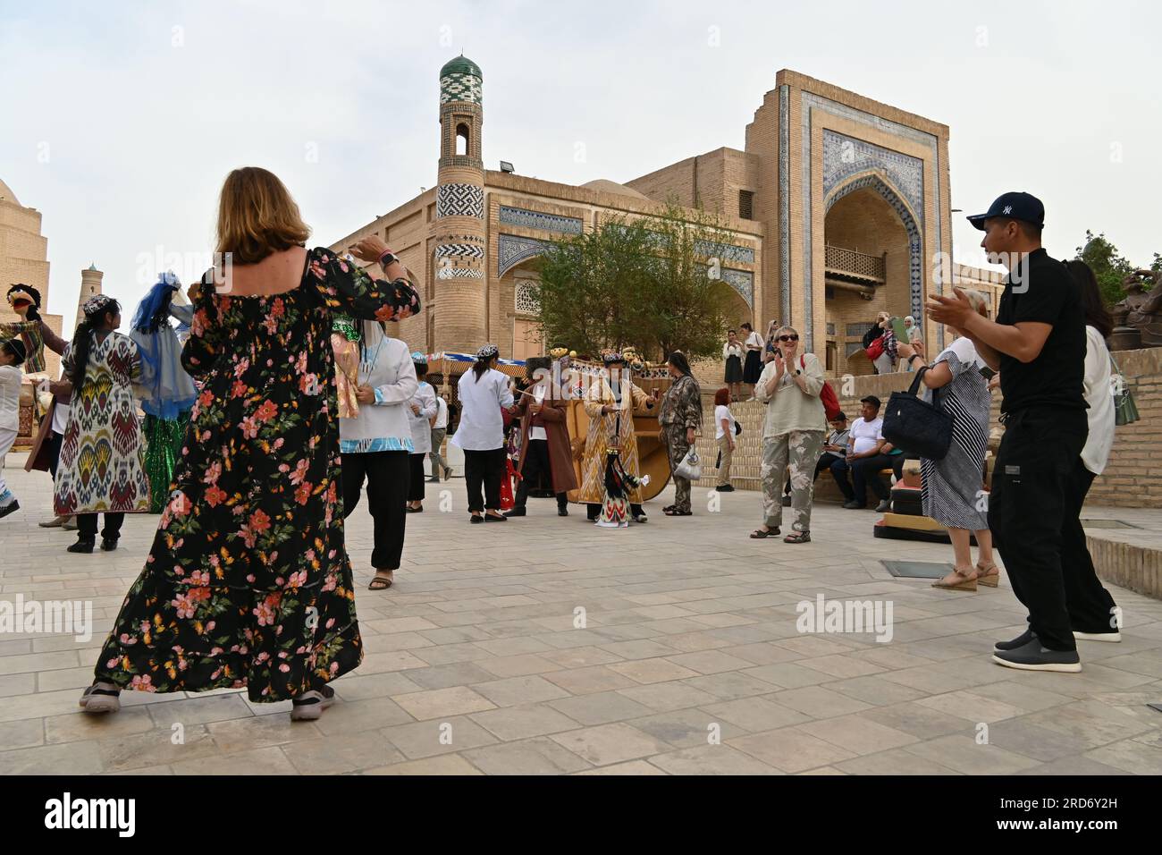 Group of happy uzbek people dance on the street during a live ...