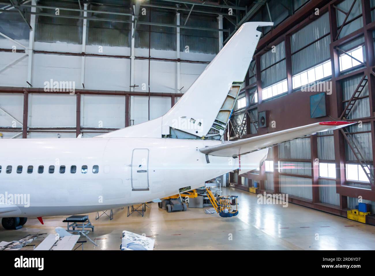 The back of a passenger airplane under maintenance in the hangar ...