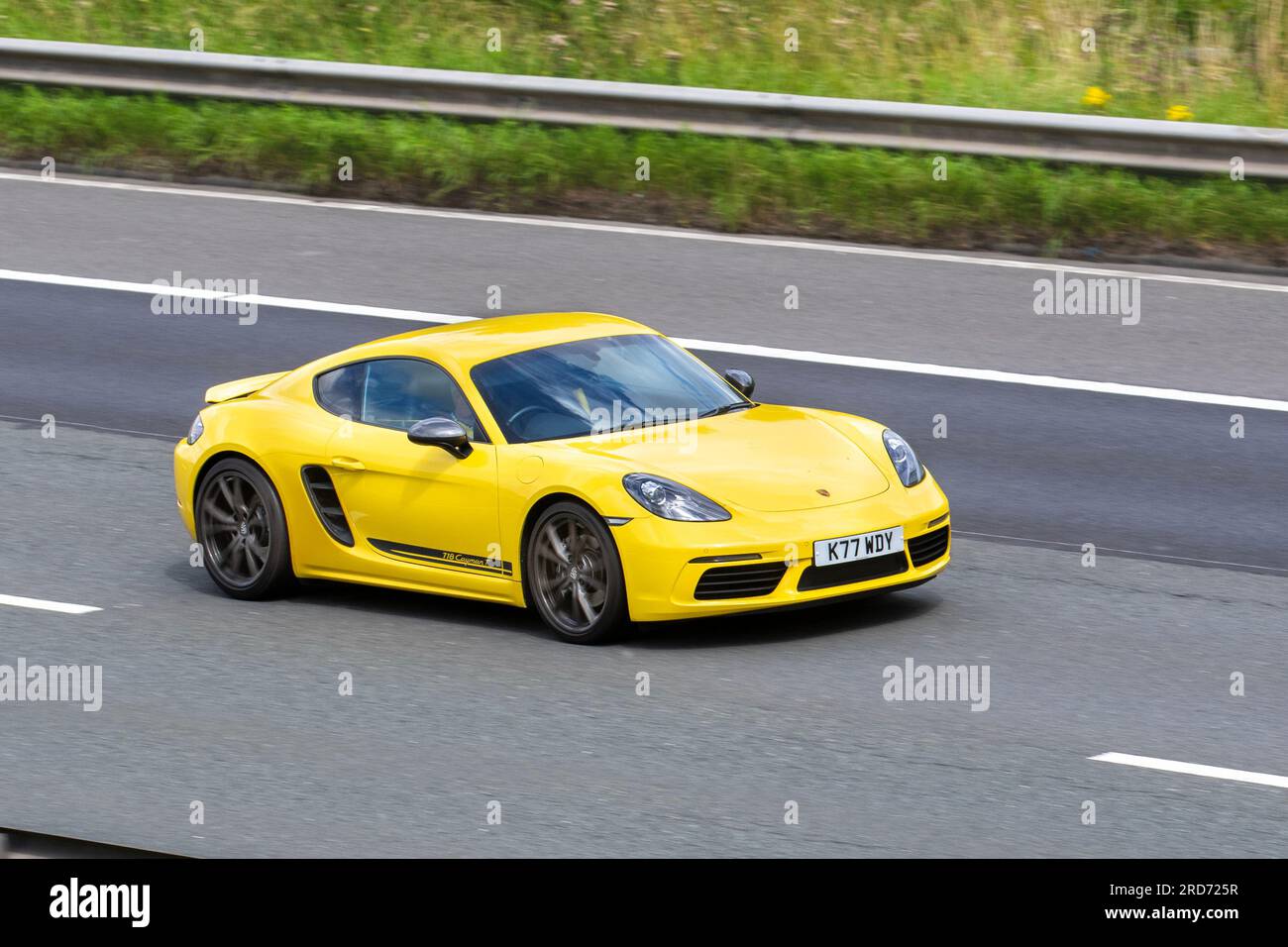 2016 yellow Porsche 718 Cayman S S-A driving travelling at speed on the ...