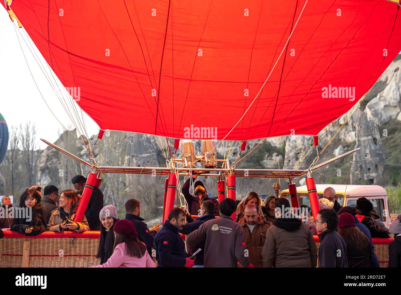 Balloonista firing up Hot air balloon before start Tourists boarded in ...