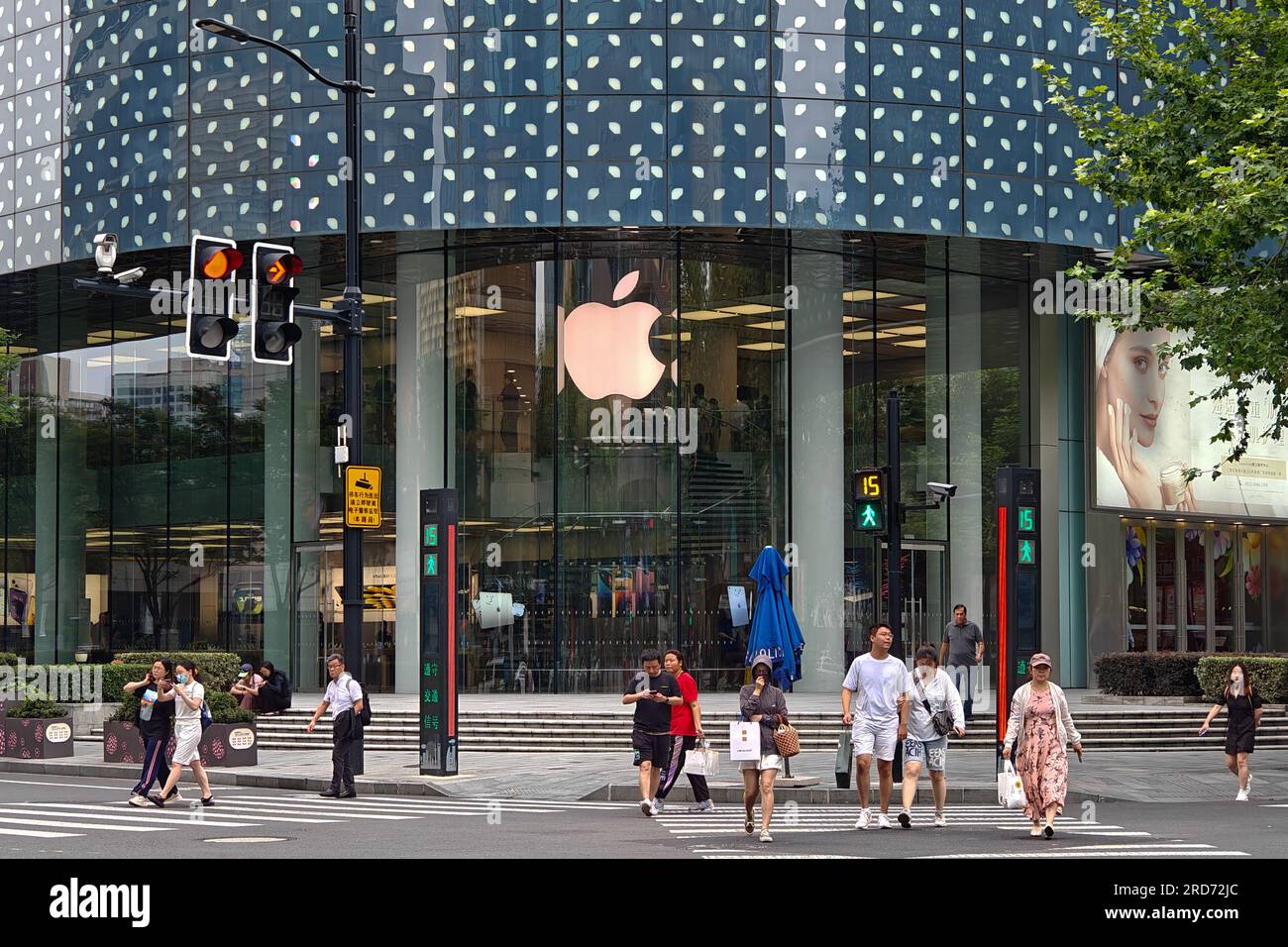 SHANGHAI, CHINA - JULY 19, 2023 - Customers walk out of an Apple Store ...