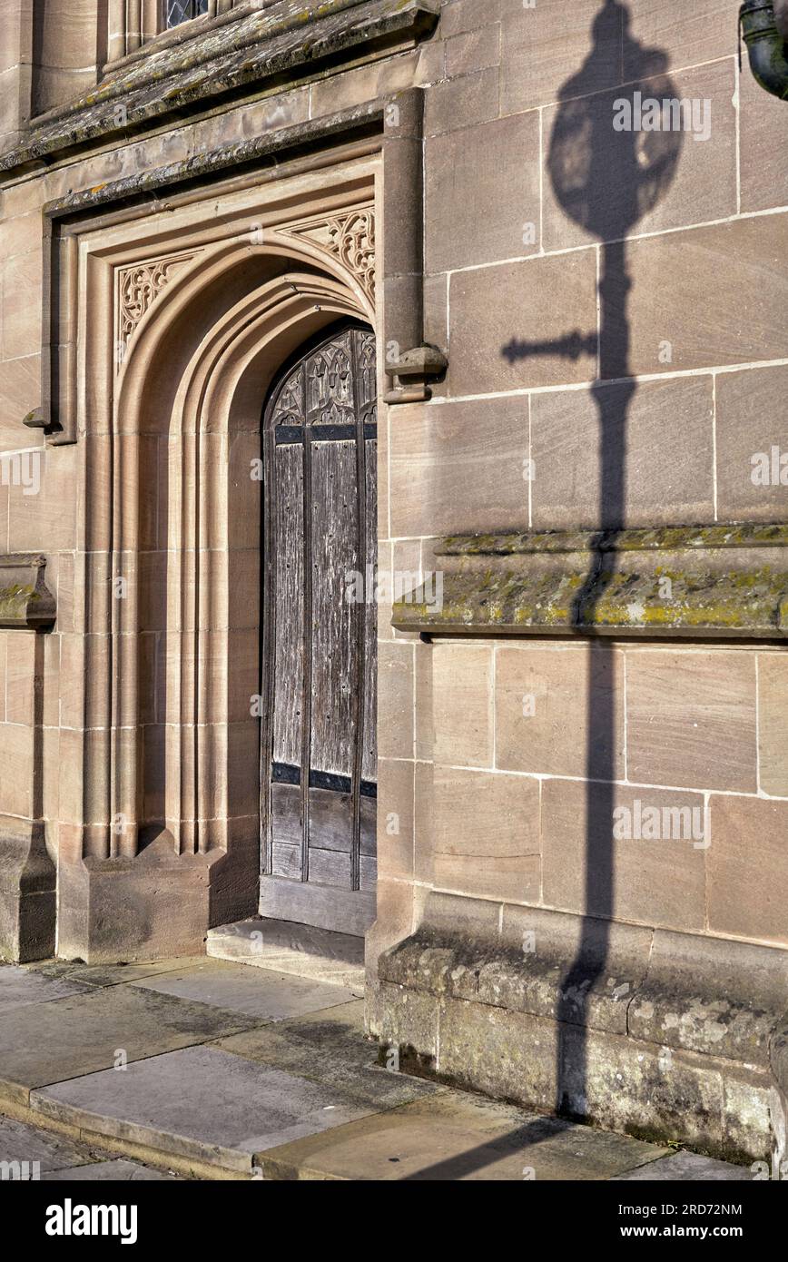 Shadows on wall. Guild Chapel doorway and street lamp shadow, Church ...
