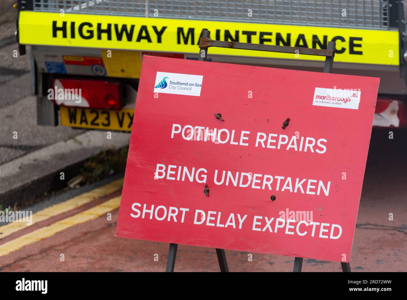 Pothole repairs being undertaken. Short delay expected. Road sign ...