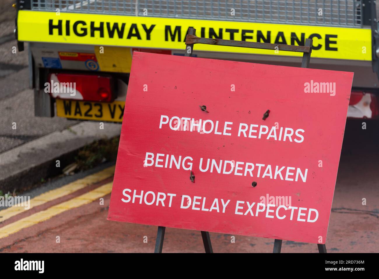 Pothole repairs being undertaken. Short delay expected. Road sign ...
