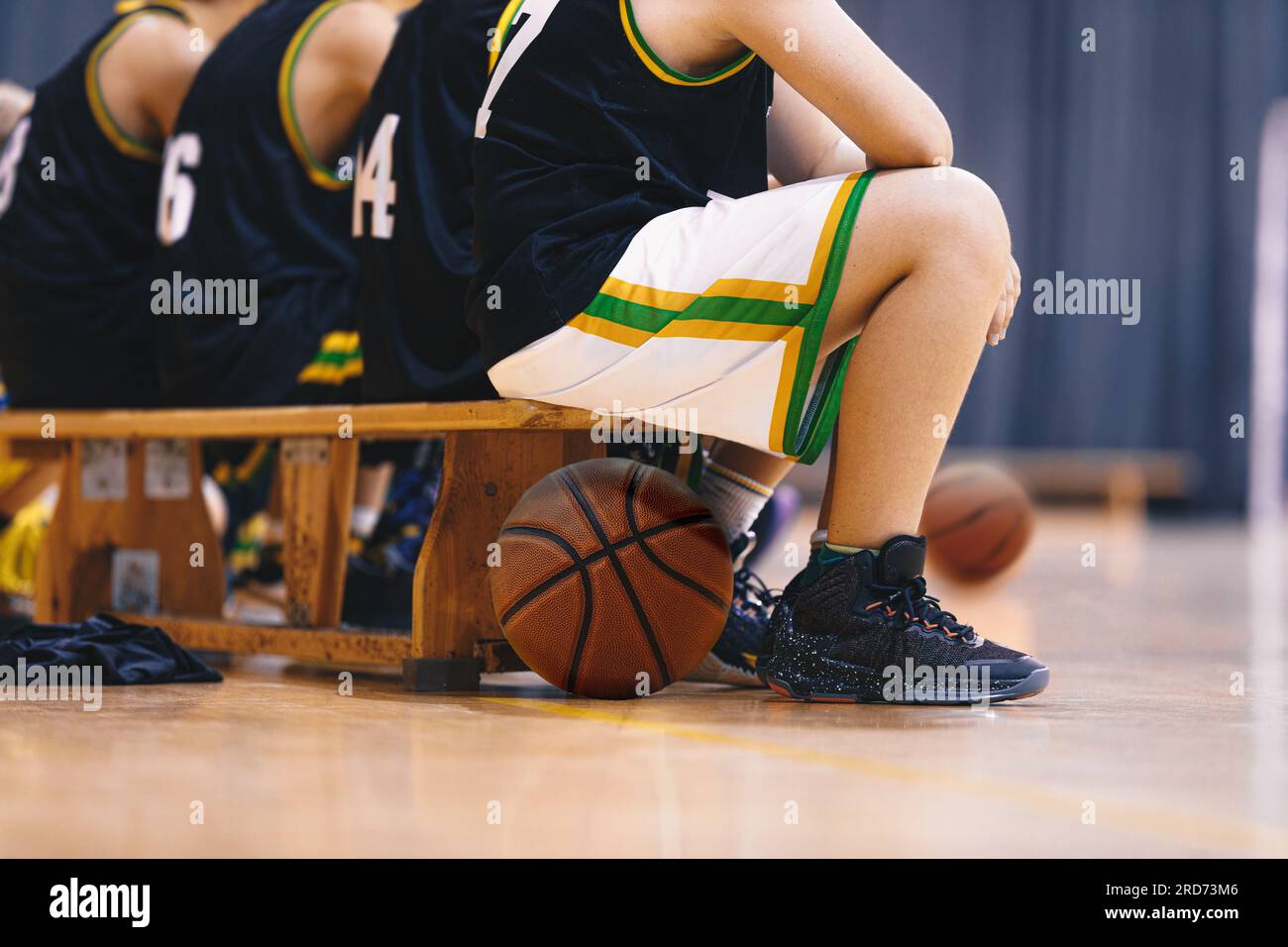 Basketball Players Sitting on Wooden Bench. Group of Teenage School ...