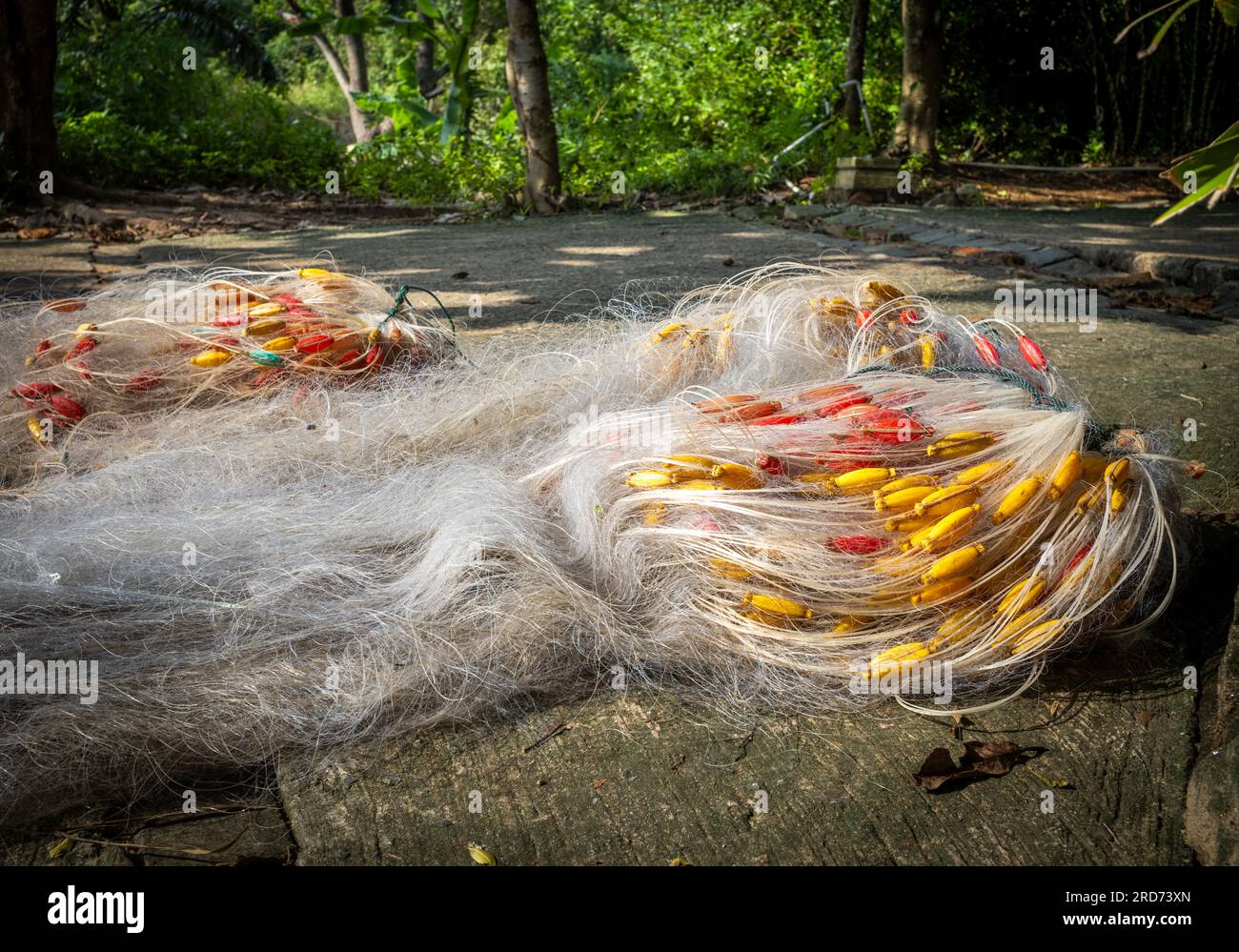 Inshore fishing nets with colourful red and yellow floats laid out in ...