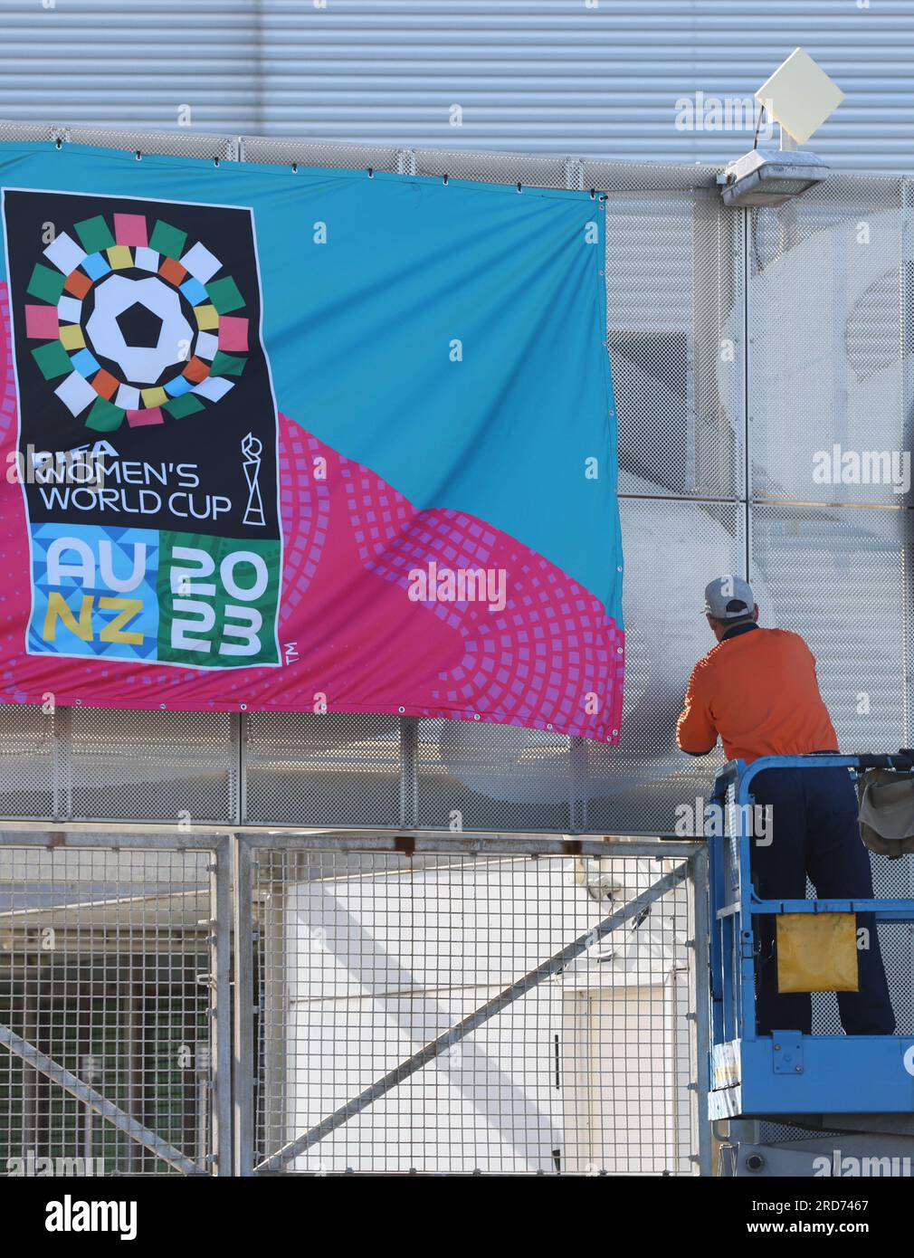 Wellington. 17th July, 2023. A worker works on a giant banner of 2023 ...