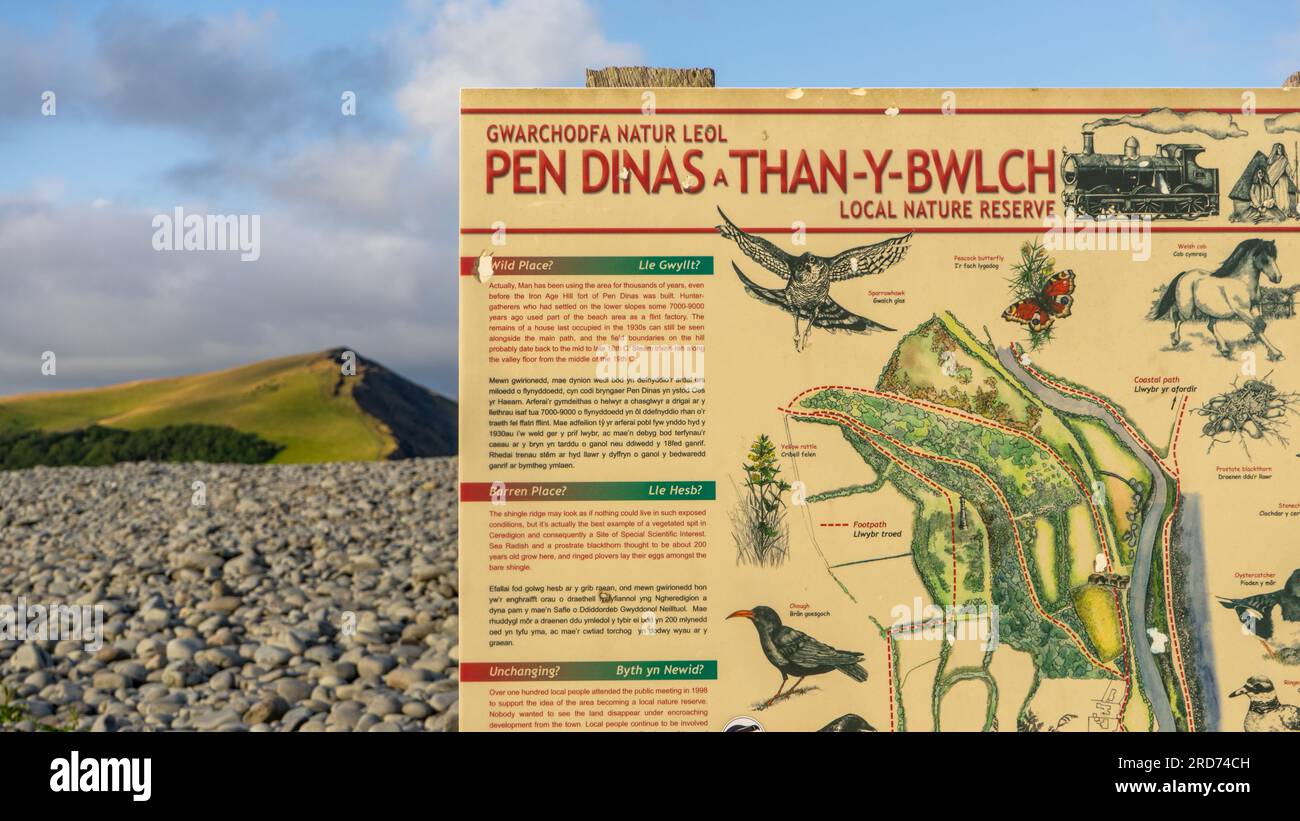 Bilingual Welsh English sign by beach and harbour at Aberystwyth, Wales ...