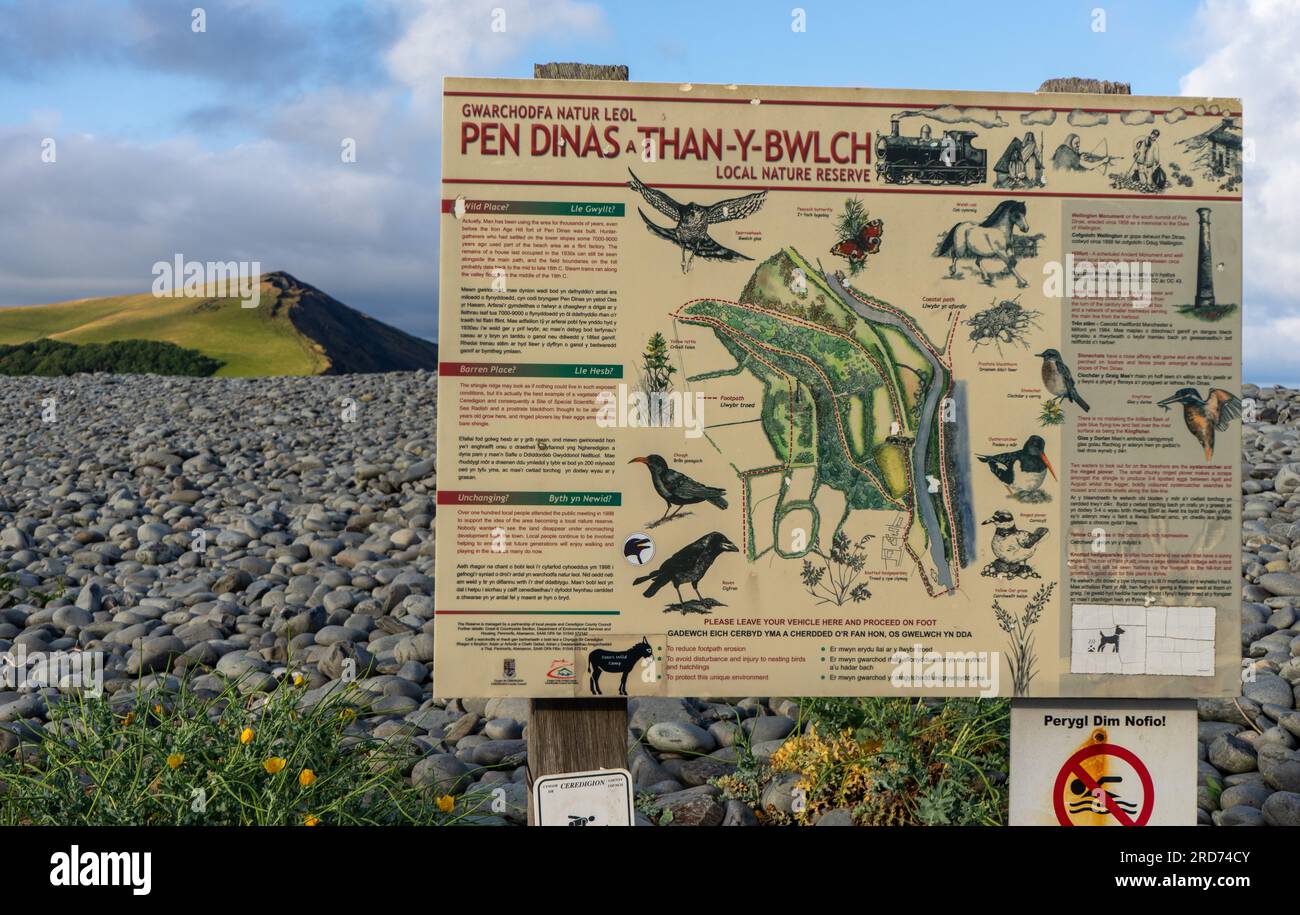 Bilingual Welsh English sign by beach and harbour at Aberystwyth, Wales ...