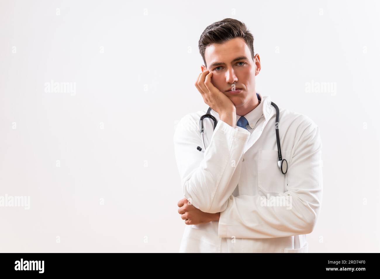 Image of worried and tired doctor thinking Stock Photo - Alamy