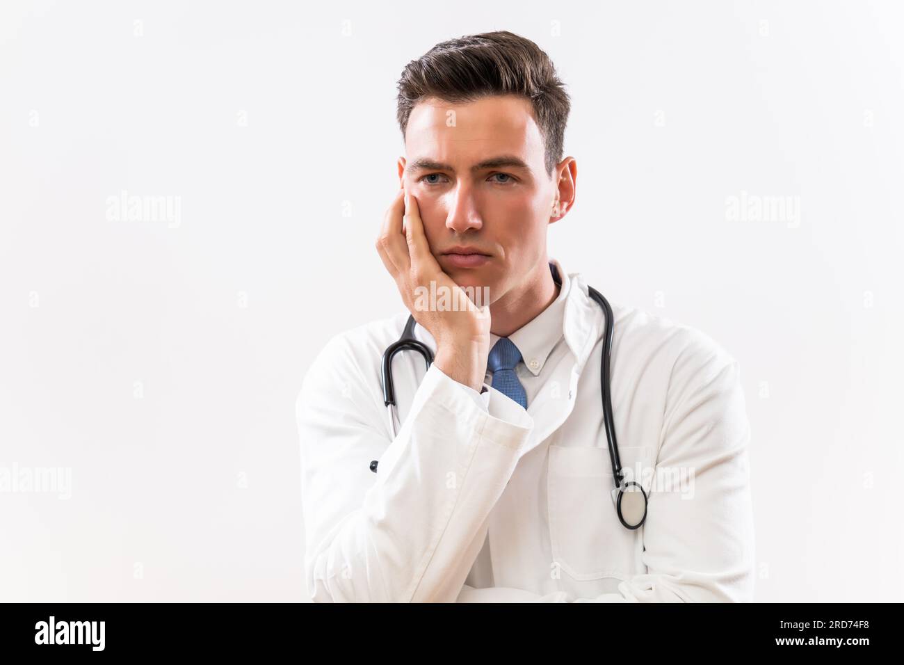 Image of worried and tired doctor thinking Stock Photo - Alamy