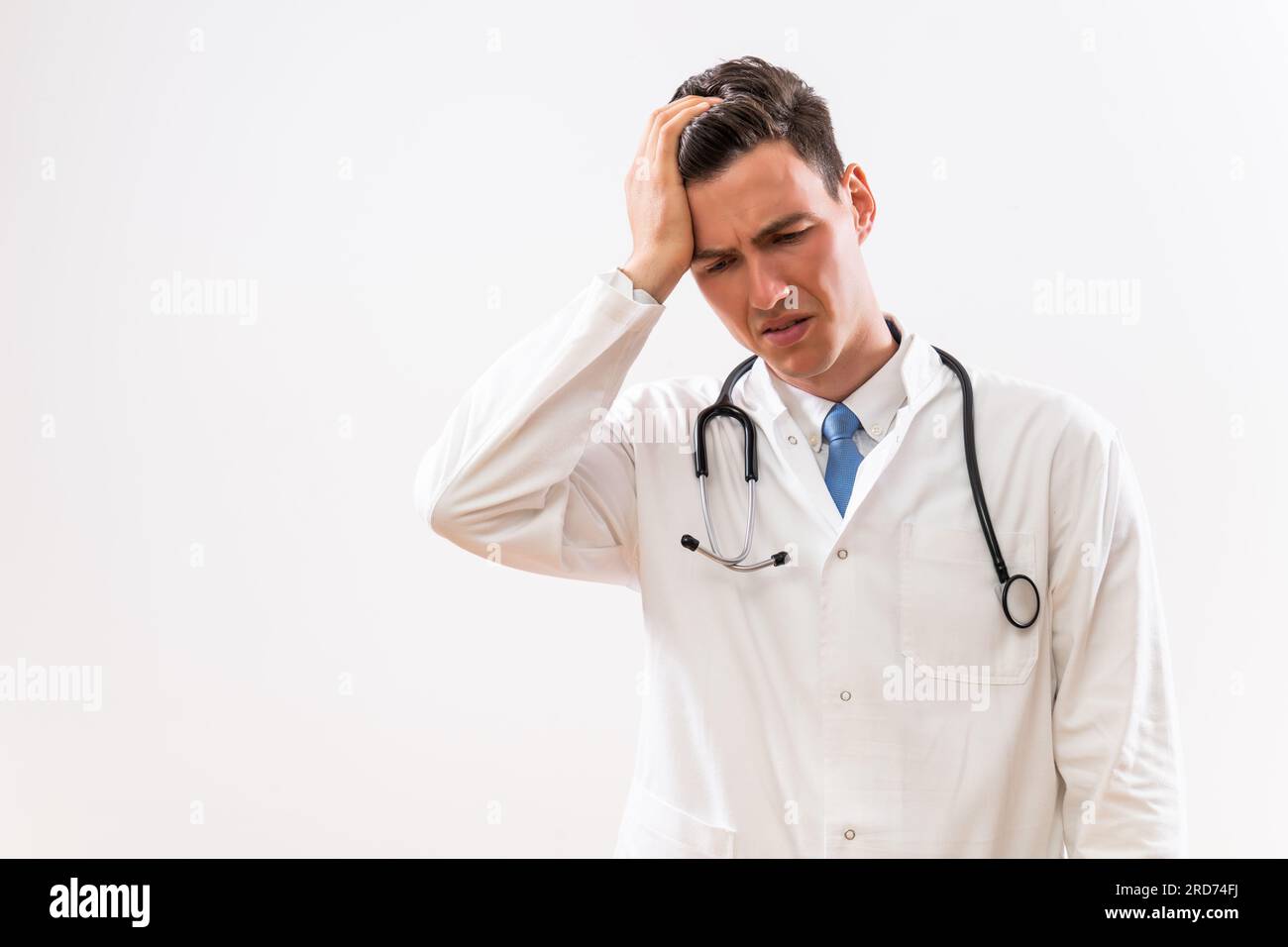 Image of worried and tired doctor thinking Stock Photo - Alamy