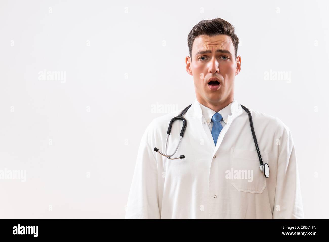 Portrait of young doctor in panic Stock Photo - Alamy