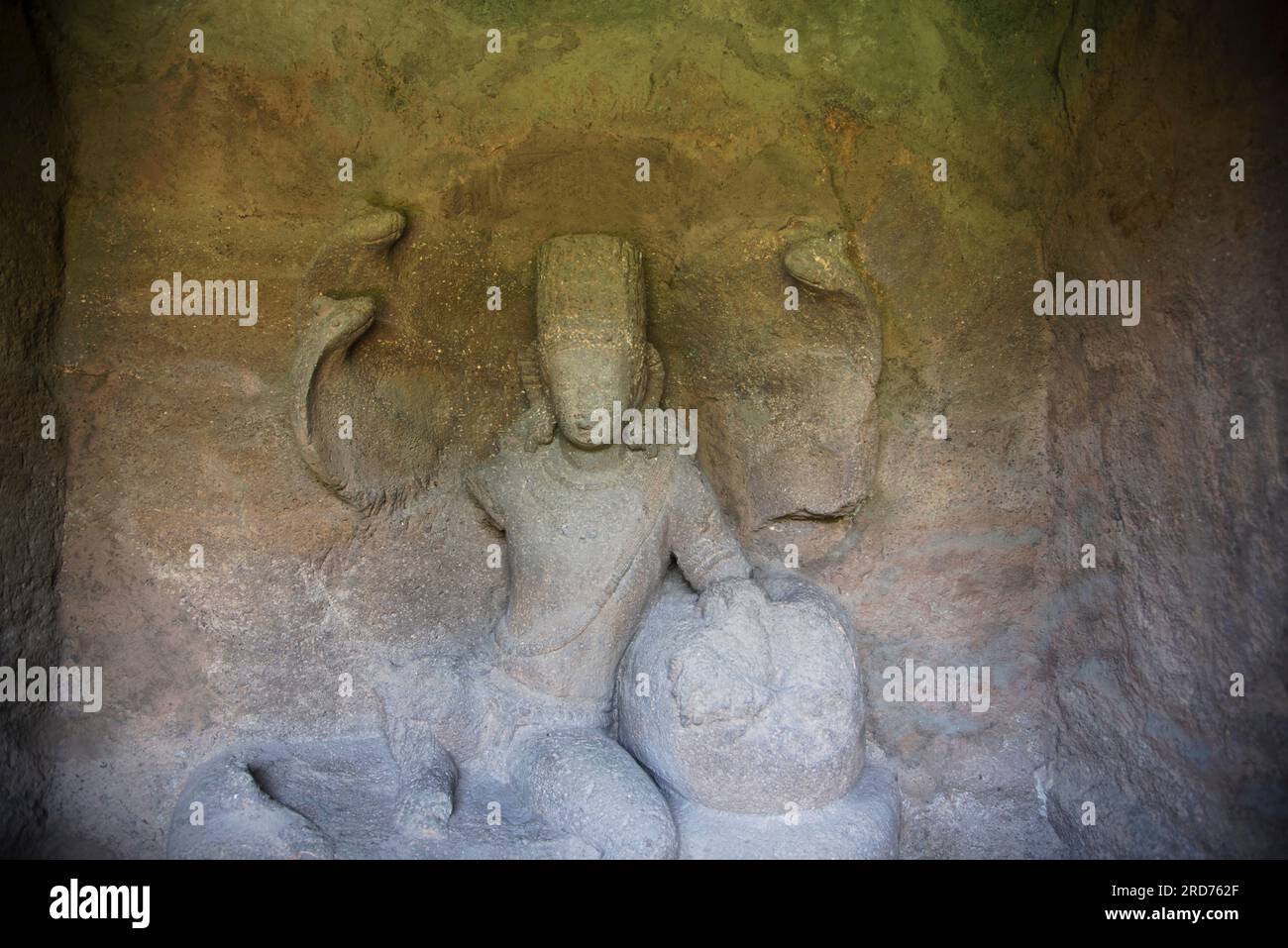Cave 16: Seated Nagaraja in shrinelet of the Elephant Gate. Ajanta ...