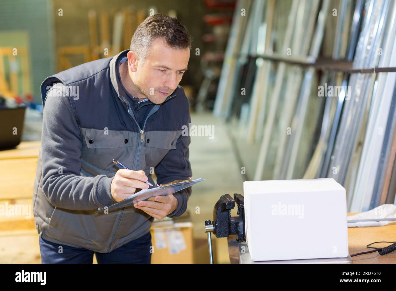 Inspecting boxes hi-res stock photography and images - Alamy
