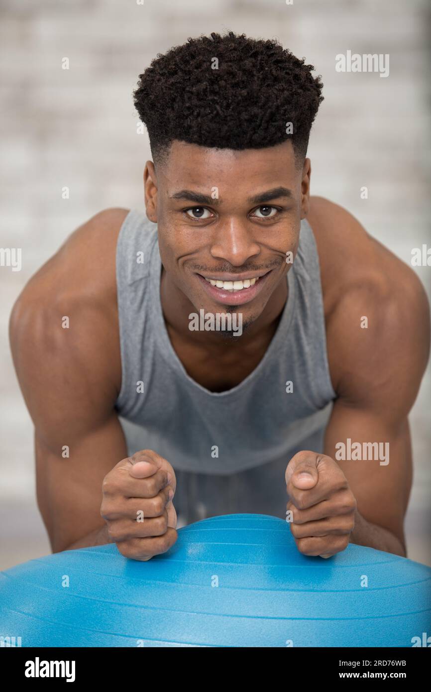 muscular man training on an aerobic ball Stock Photo - Alamy