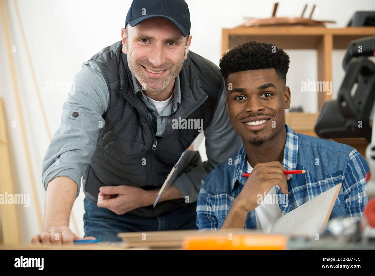 trainer and apprentice are smiling at the camera Stock Photo - Alamy