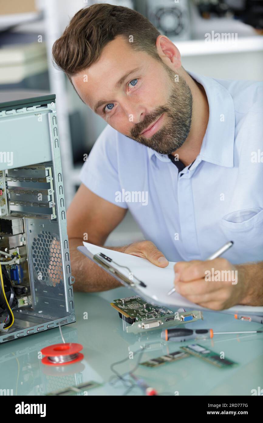male worker during computer motherboard diagnostics Stock Photo - Alamy