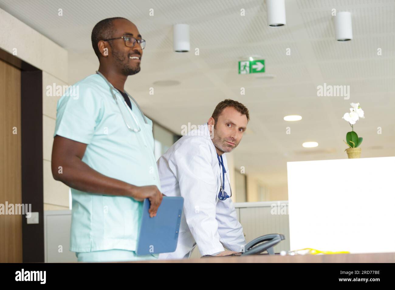 team of a doctor and medical secretary Stock Photo - Alamy