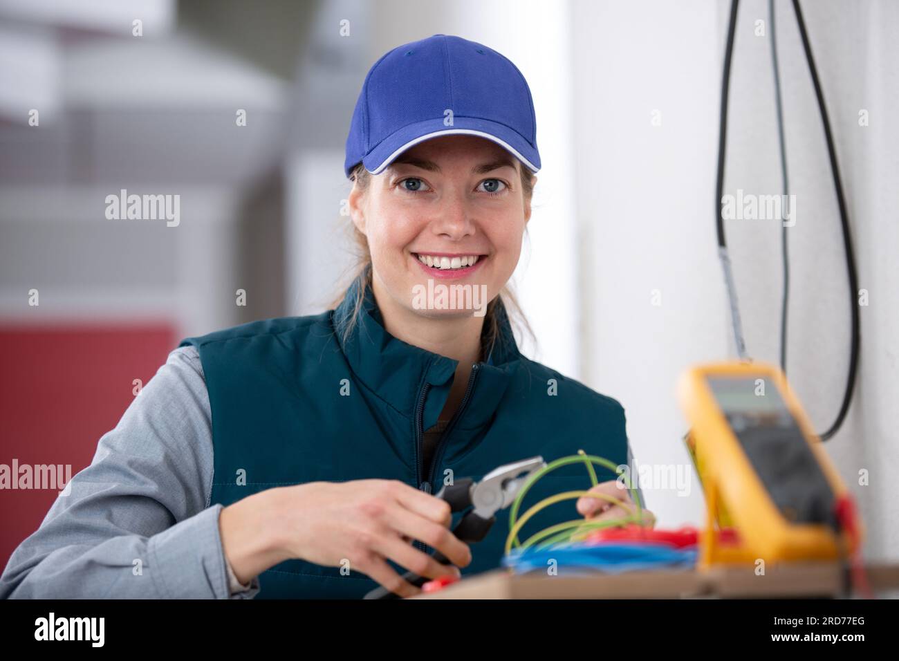 happy woman technician smiling at camera Stock Photo - Alamy