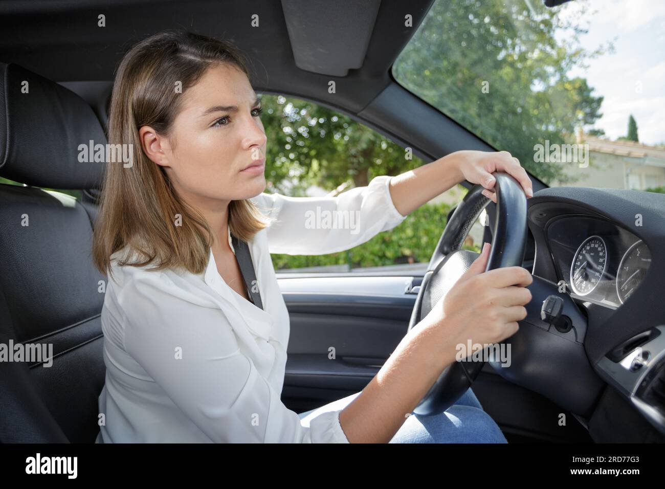 young woman driving a car Stock Photo - Alamy