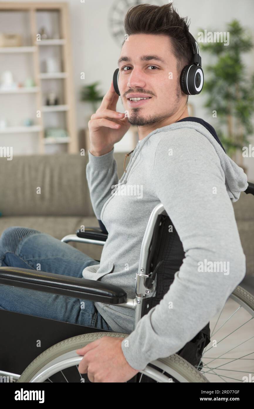 smiling handicapped man excited about new track Stock Photo - Alamy