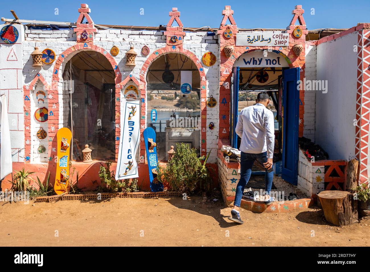 A man walks into a colourful coffeeshop at a Nubian village in Aswan ...