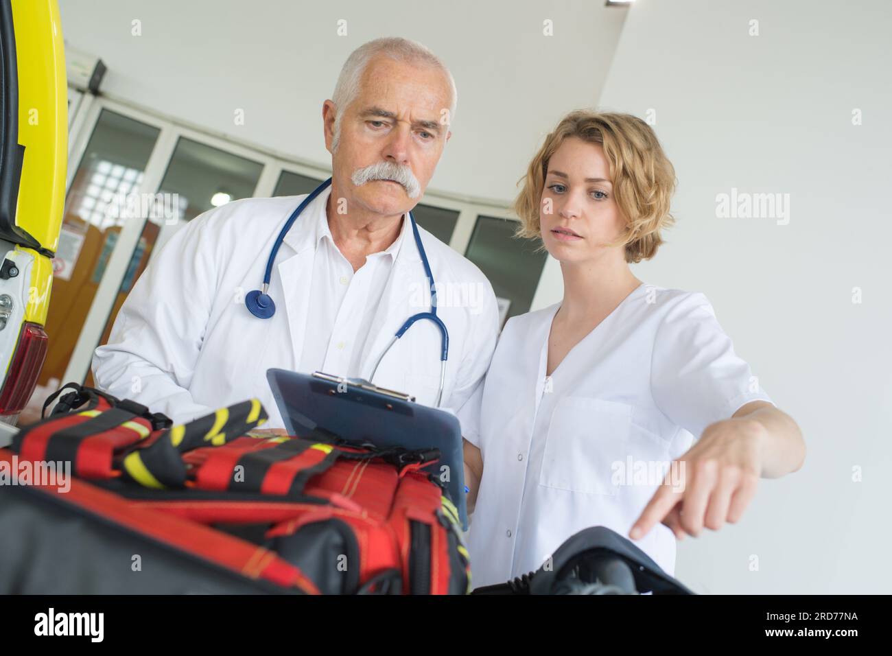 doctors in hospital with ambulance Stock Photo - Alamy