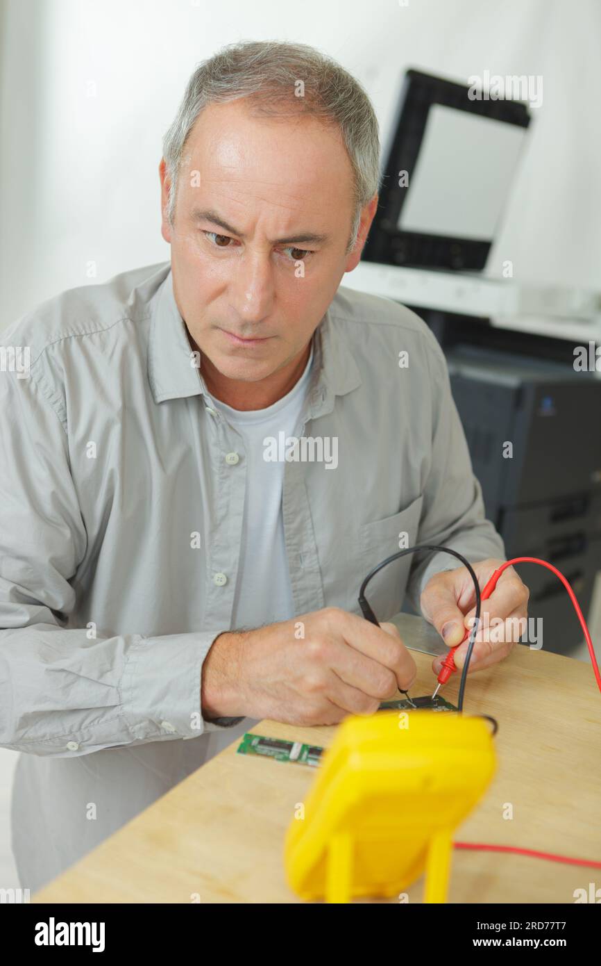 electrical worker checks high voltage cable Stock Photo - Alamy