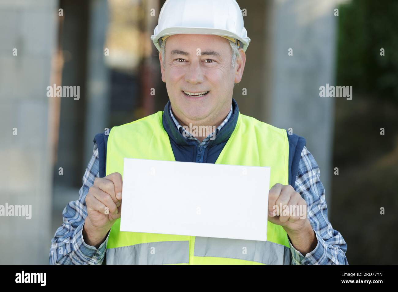 happy engineer showing a blank sign Stock Photo - Alamy